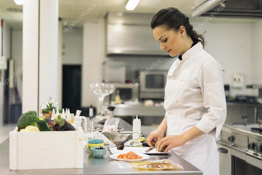 Pretty professional chef cooking. — Stock Photo © santypan #101834654
