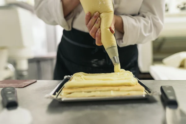 Female pastry chef decorating dessert - Stock Image - Everypixel