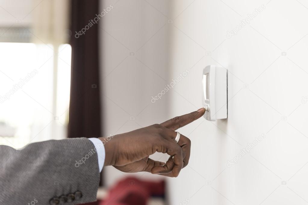 Hand push button digital climate control — Stock Photo © santypan #72652401