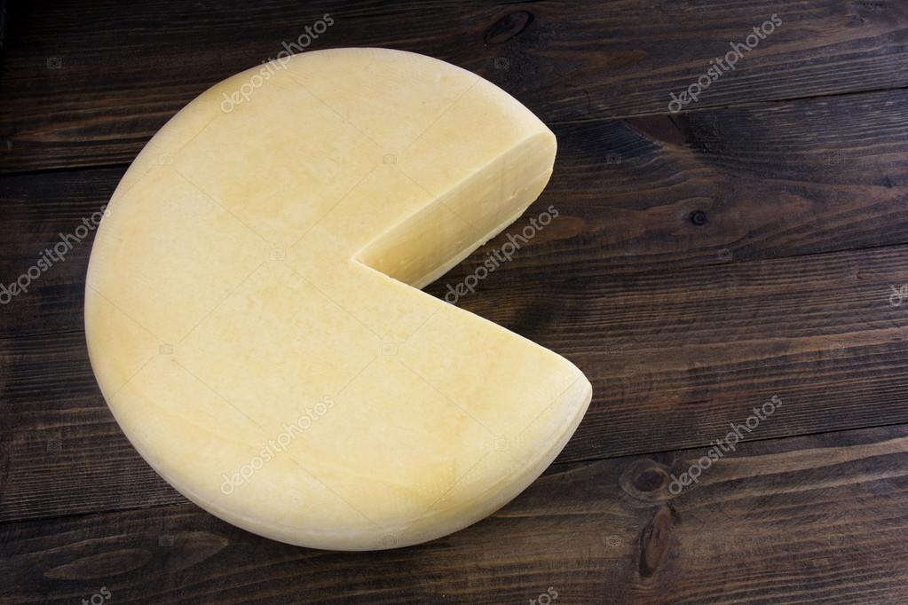 Large round cheese Stock Photo by ©Marripopins 101394094