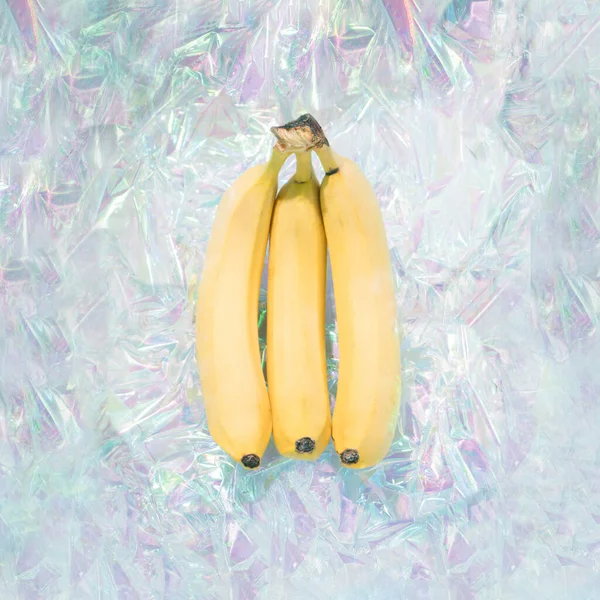 Bananas in iridescent neon background. Abstract holographic soft pastel ...