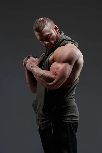 Muscular White Man Shows Biceps Dark Background Stock Photo by ©Ksenia ...
