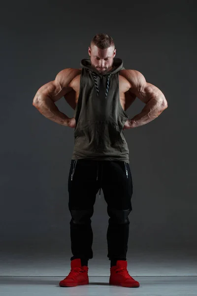 Muscular White Man Shows Biceps Dark Background Stock Photo by ©Ksenia ...