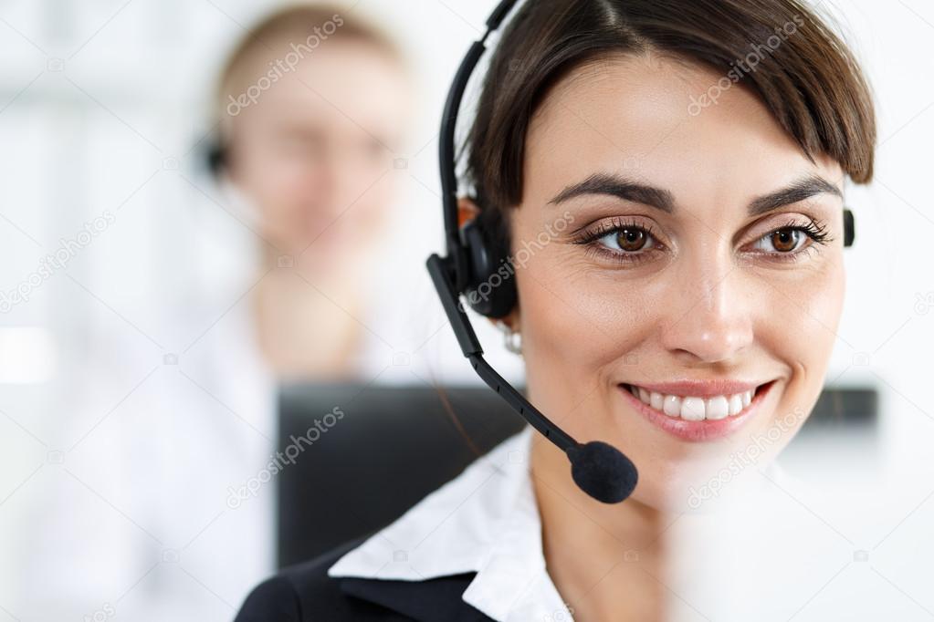 Female call center service operator at work Stock Photo by ©megaflopp 86173072
