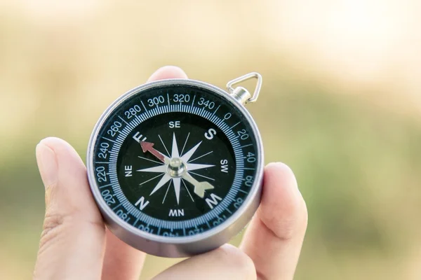 Compass in human hand - Stock Image - Everypixel