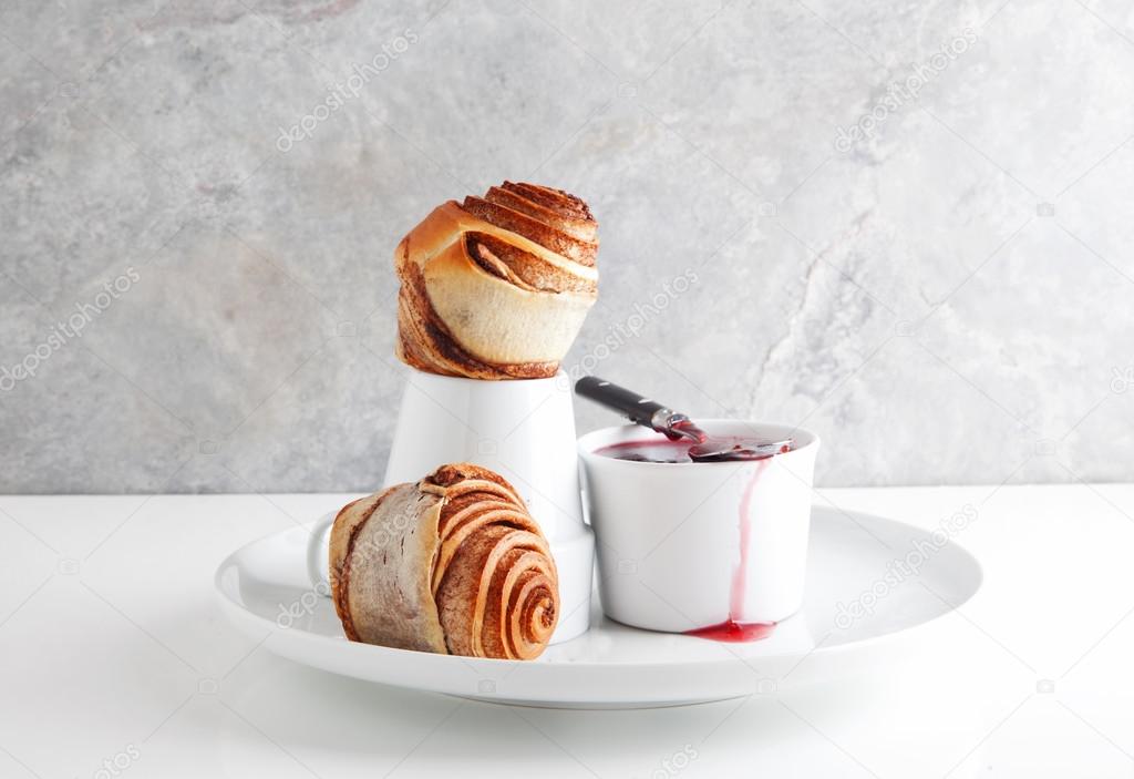 Cinnamon roll and raspberry jam. Stock Photo by ©IriGri 107927498