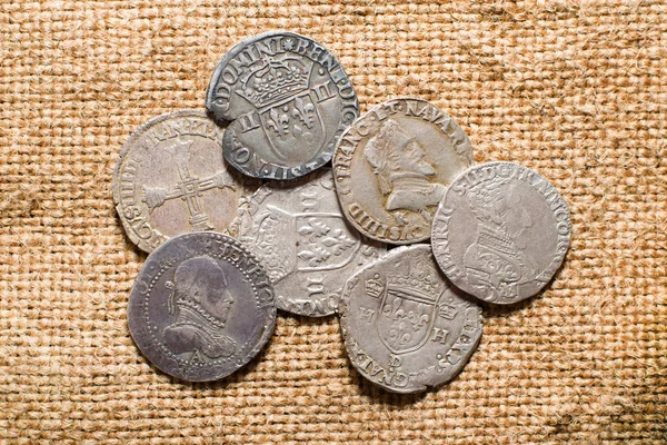 Vintage silver coins with portraits on the old cloth - Stock Image ...