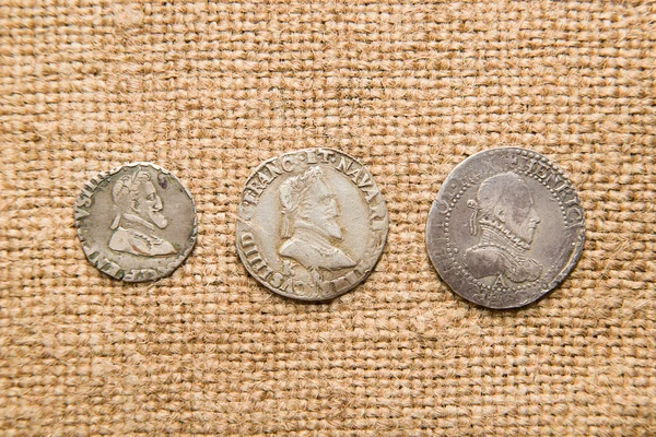 Vintage silver coins with portraits on the old cloth - Stock Image ...