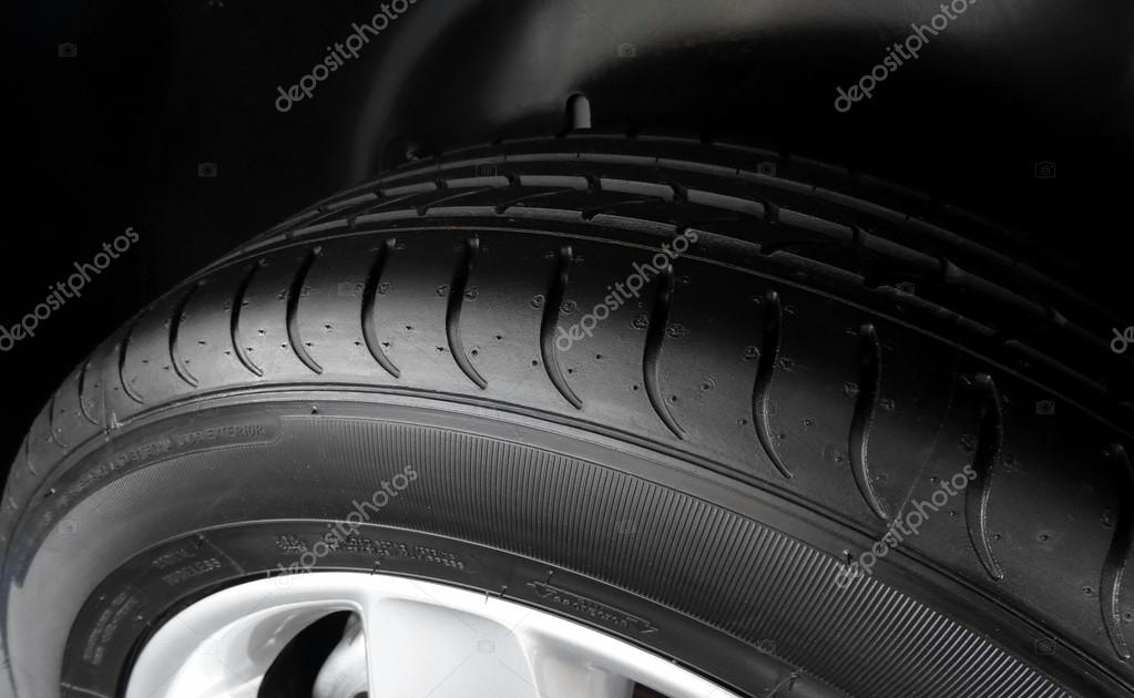 Car parts shop. Tread blocks and grooves on new tire detailed — Stock ...