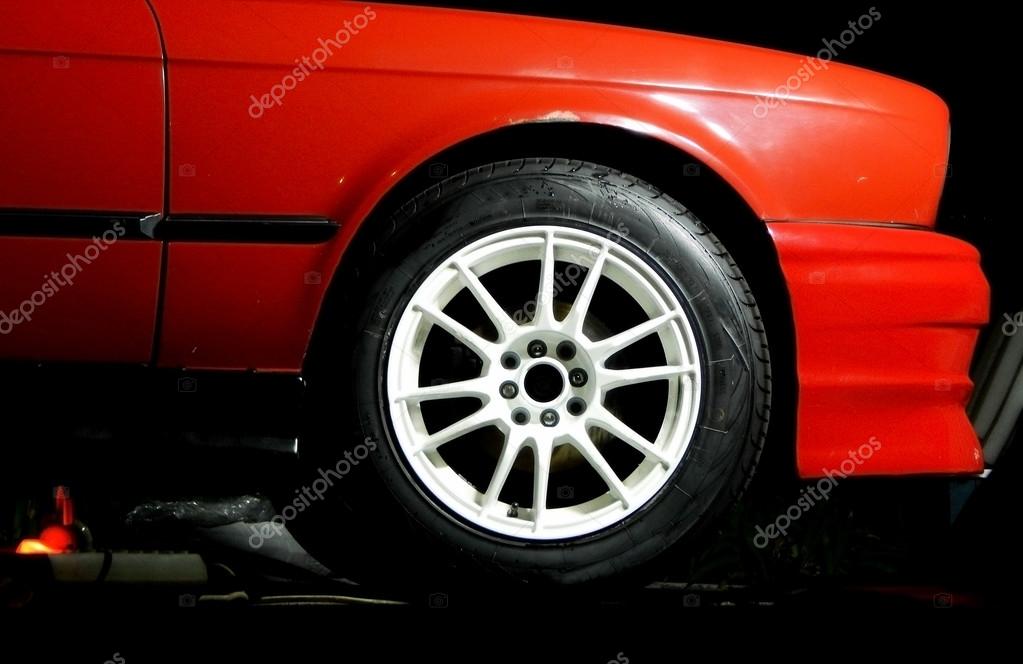 Custom white wheel mounted om the red sport car — Stock Photo ...