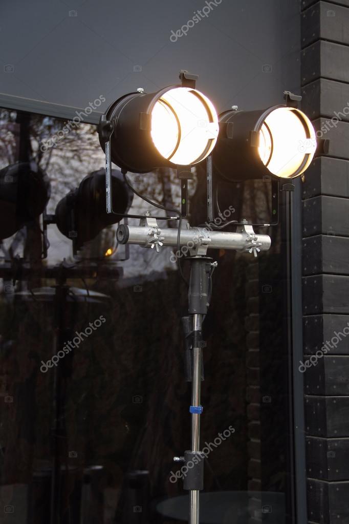 Spotlights on tripod over glass wall Stock Photo by ©AnyVidStudio 92083970