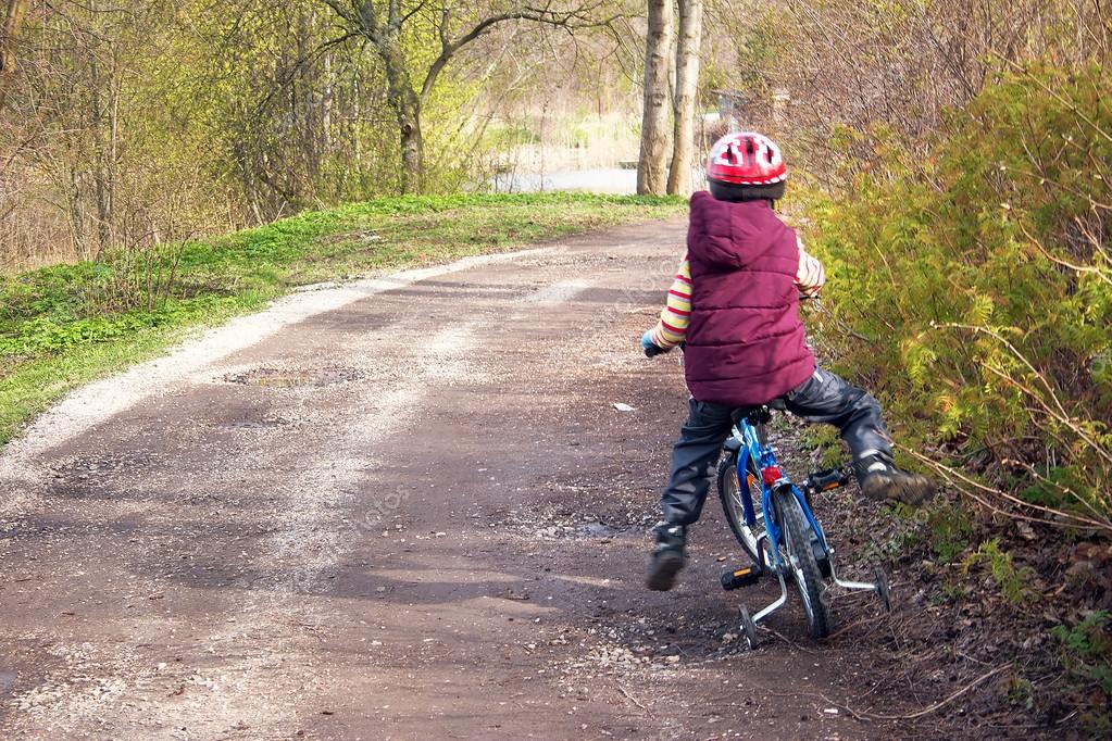 Child falling from a bike Stock Photo by ©candy18 72031477