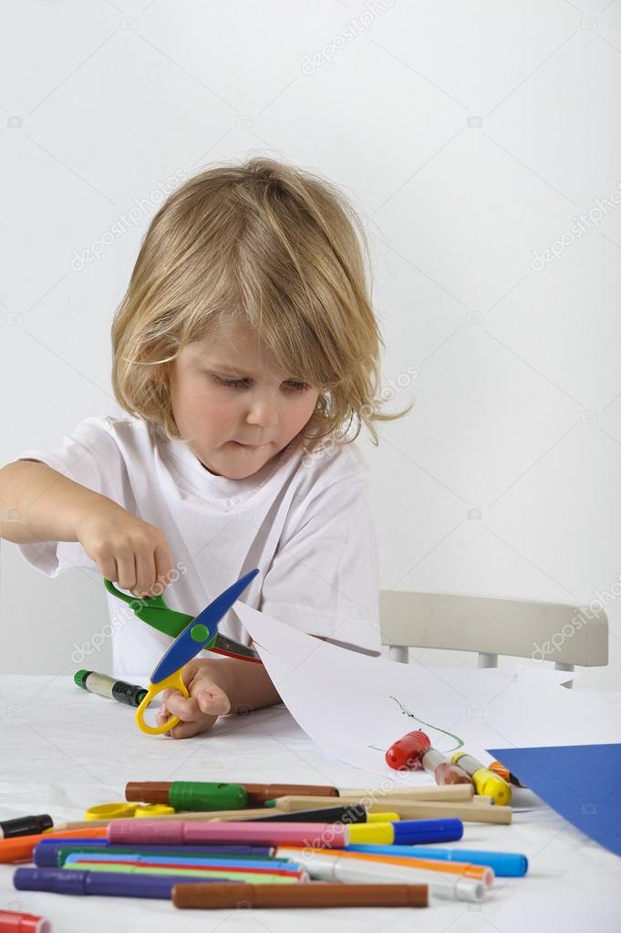 Learning to use a scissors — Stock Photo © brendel #68278803