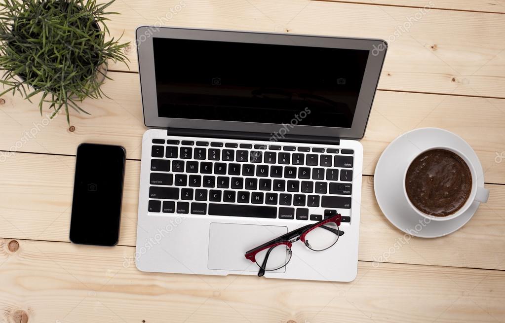 Laptop computer, phone and coffee Stock Photo by ©Nikodash 103196114