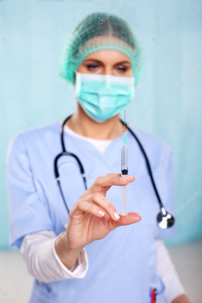 Nurse preparing an injection of botox Stock Photo by ©Nikodash 69439319