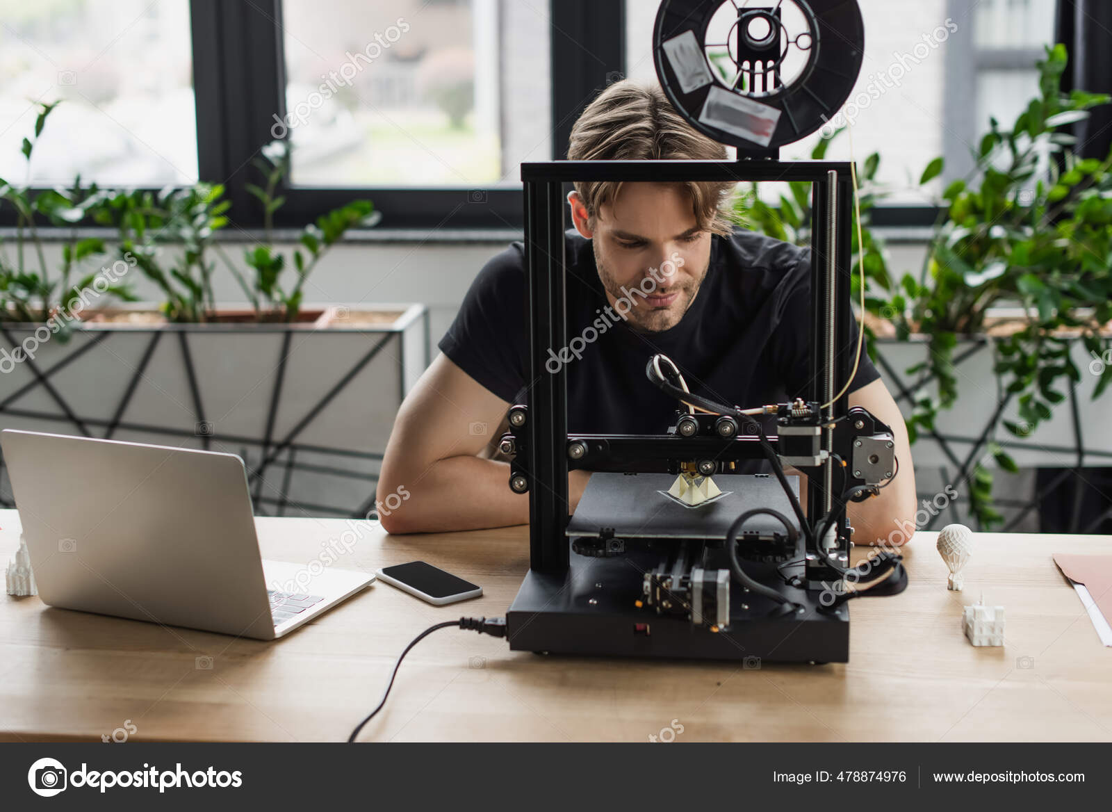 Focused Young Designer Sitting Laptop Looking Printer Modern Office ...