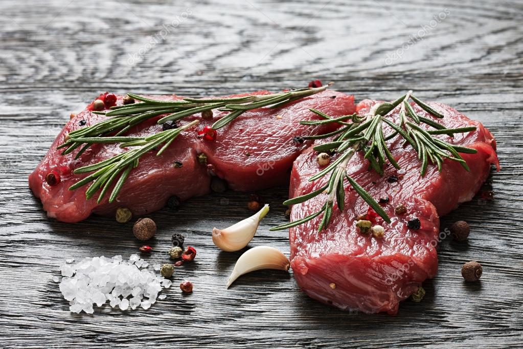 Juicy raw beef steaks — Stock Photo © kobeza #81788750