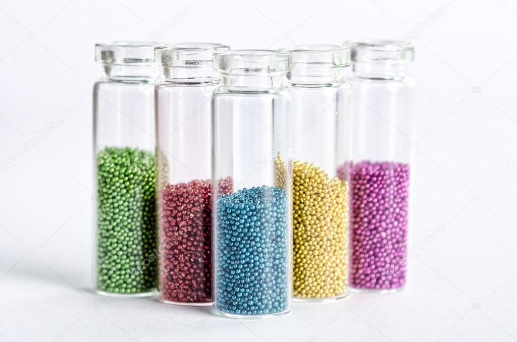 Capsules with pellets Stock Photo by ©techiya 89253128