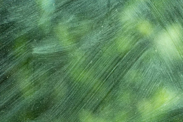 Dirty glass. Cloudy transparent surface. Stains from soap on the window ...