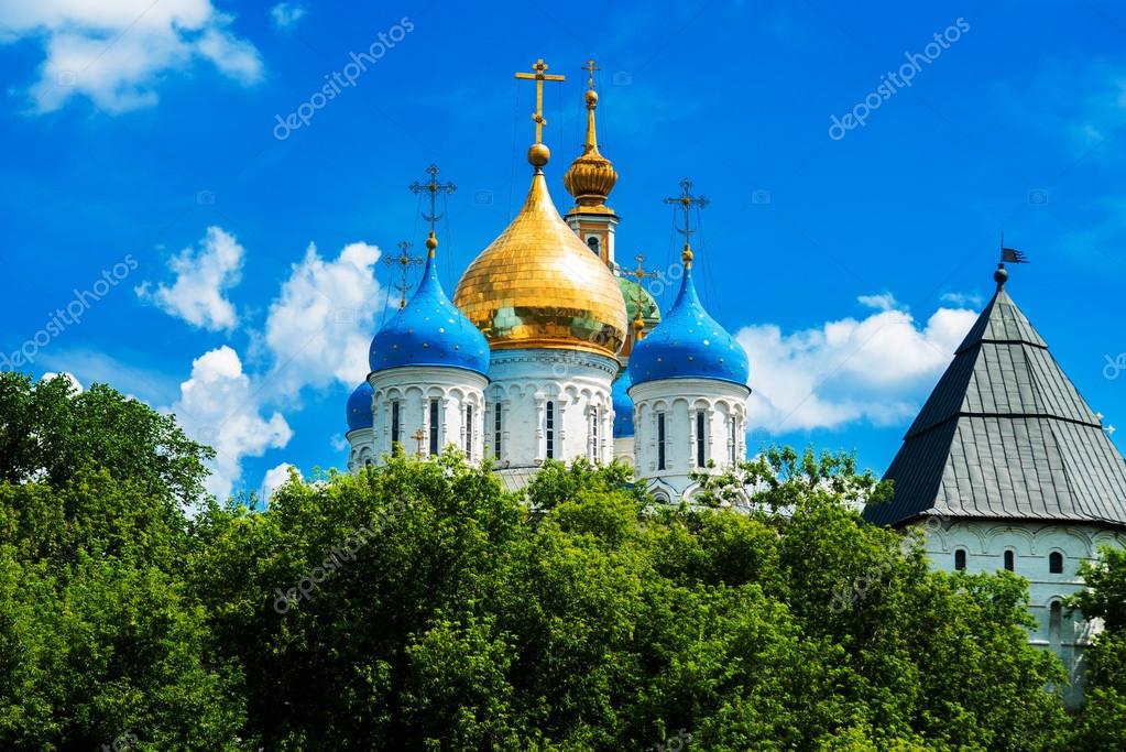Novospassky Monastery with Golden dome on the blue sky background ...