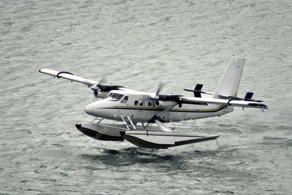 Twin propeller engine hydroplan taking off from water surface Stock ...