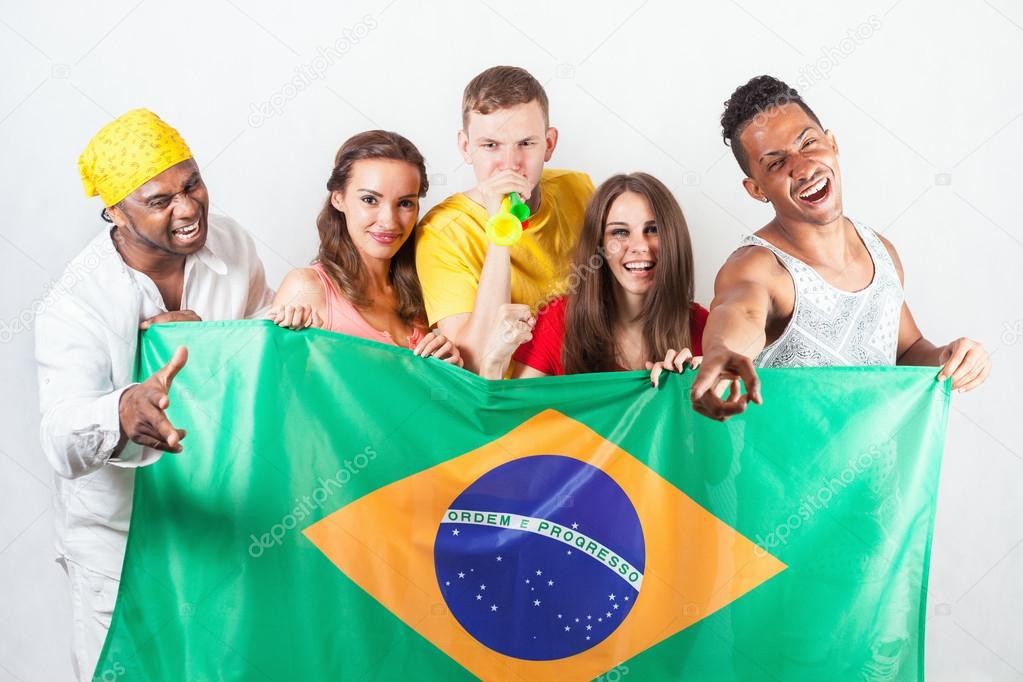 Group of multiracial people holding a Brazil flag — Stock Photo ...