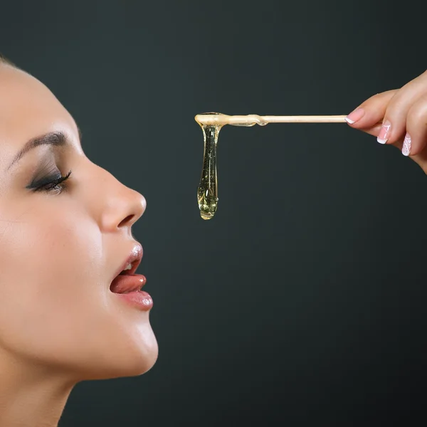 Concept sugaring epilation skin care with liquid sugar near face ...