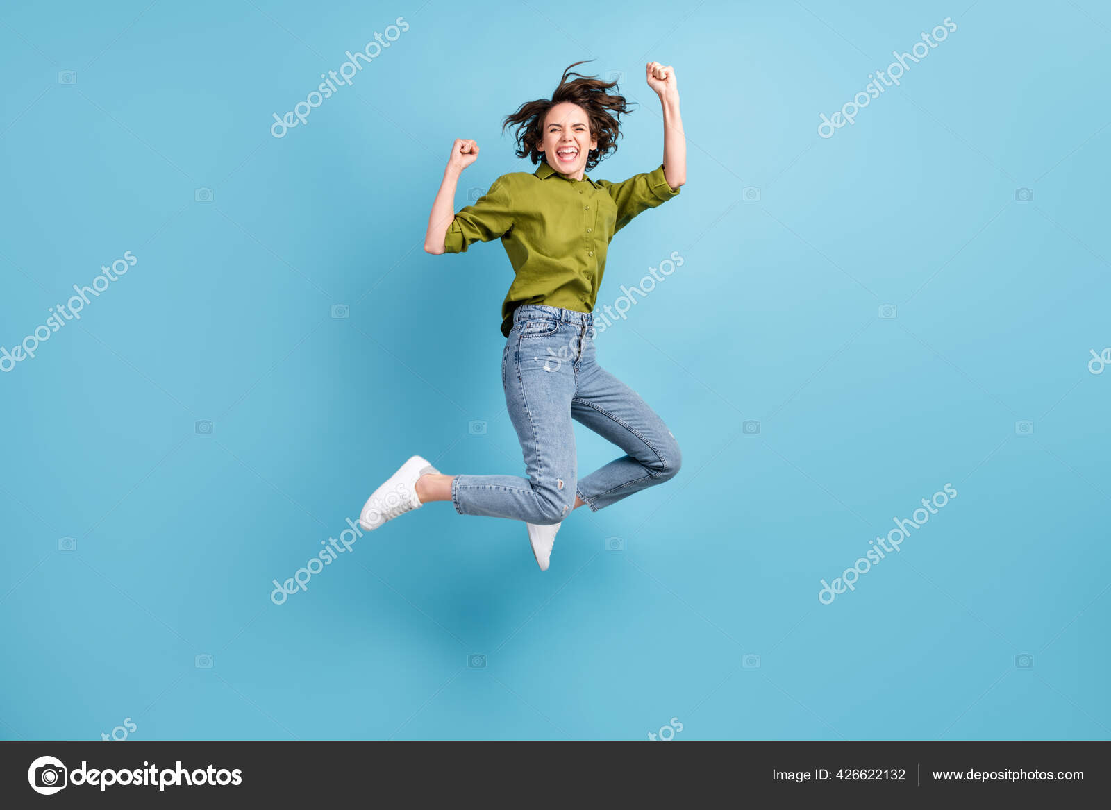Photo portrait of crazy ecstatic woman jumping up celebrating fists in ...