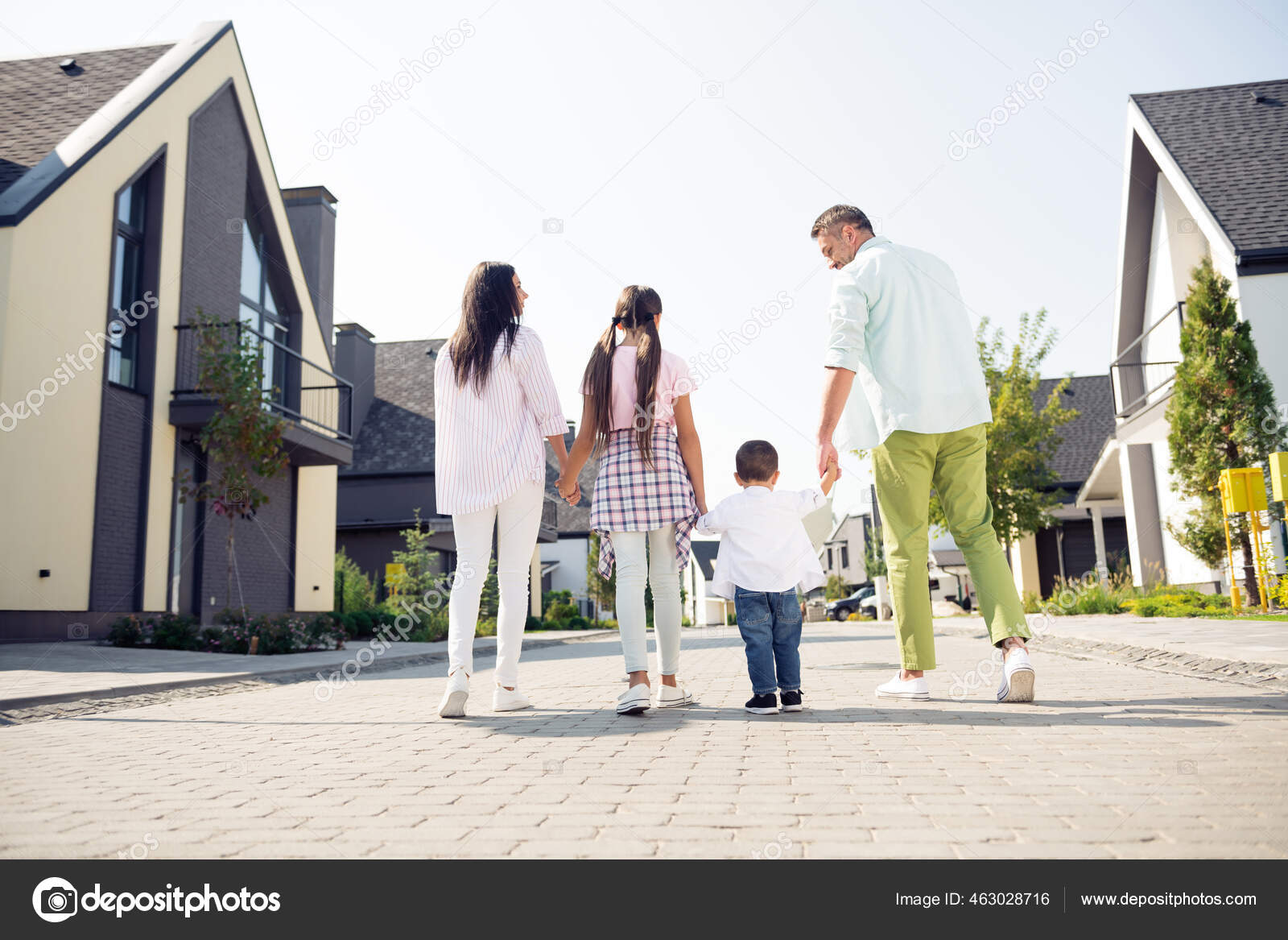 Family Walking Together From Behind