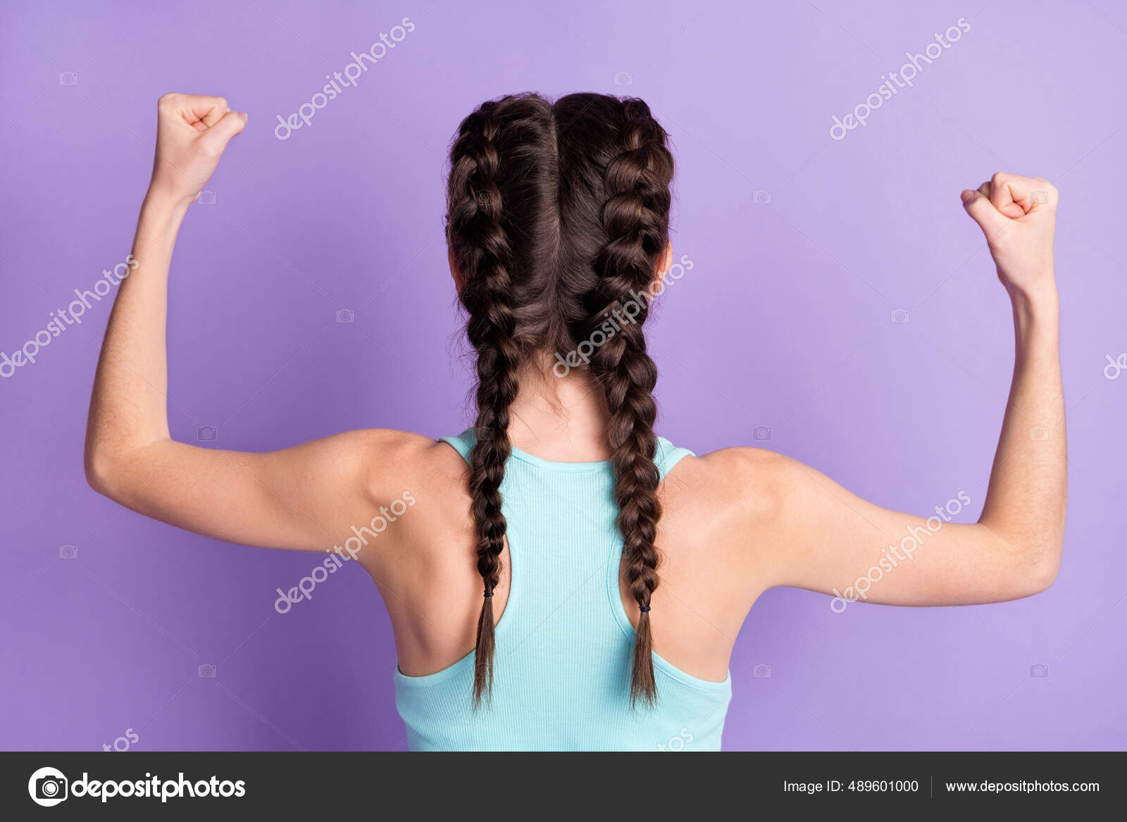 Rear back behind view portrait of attractive strong girl demonstrating ...