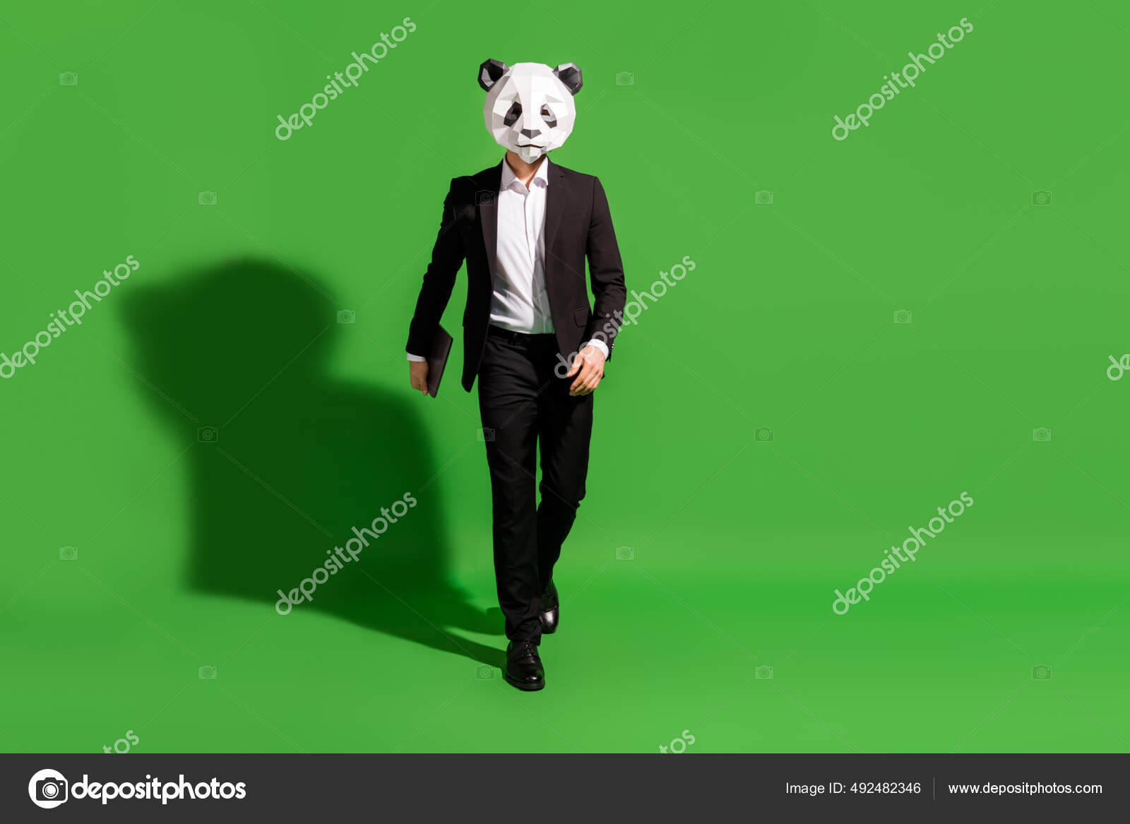 Photo of cheerful cool guy step carry netbook wear panda head black ...