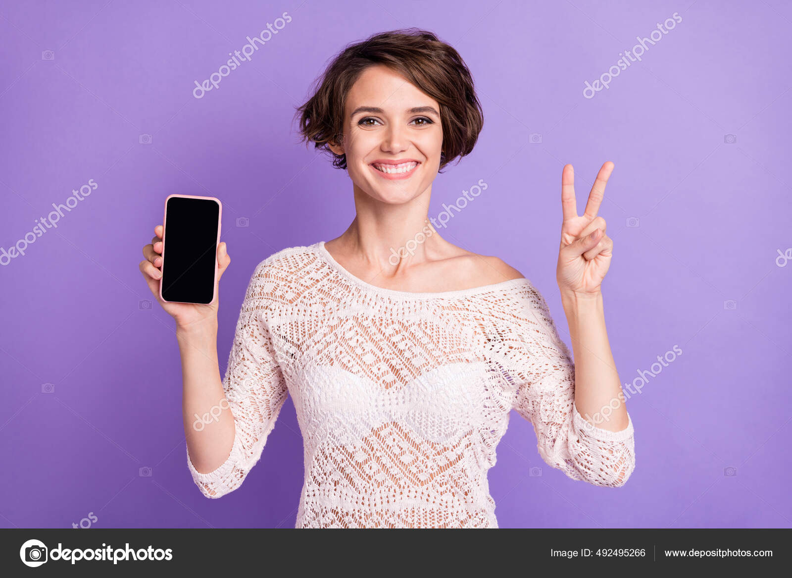 Portrait of attractive friendly lady demonstrate display fingers show v ...