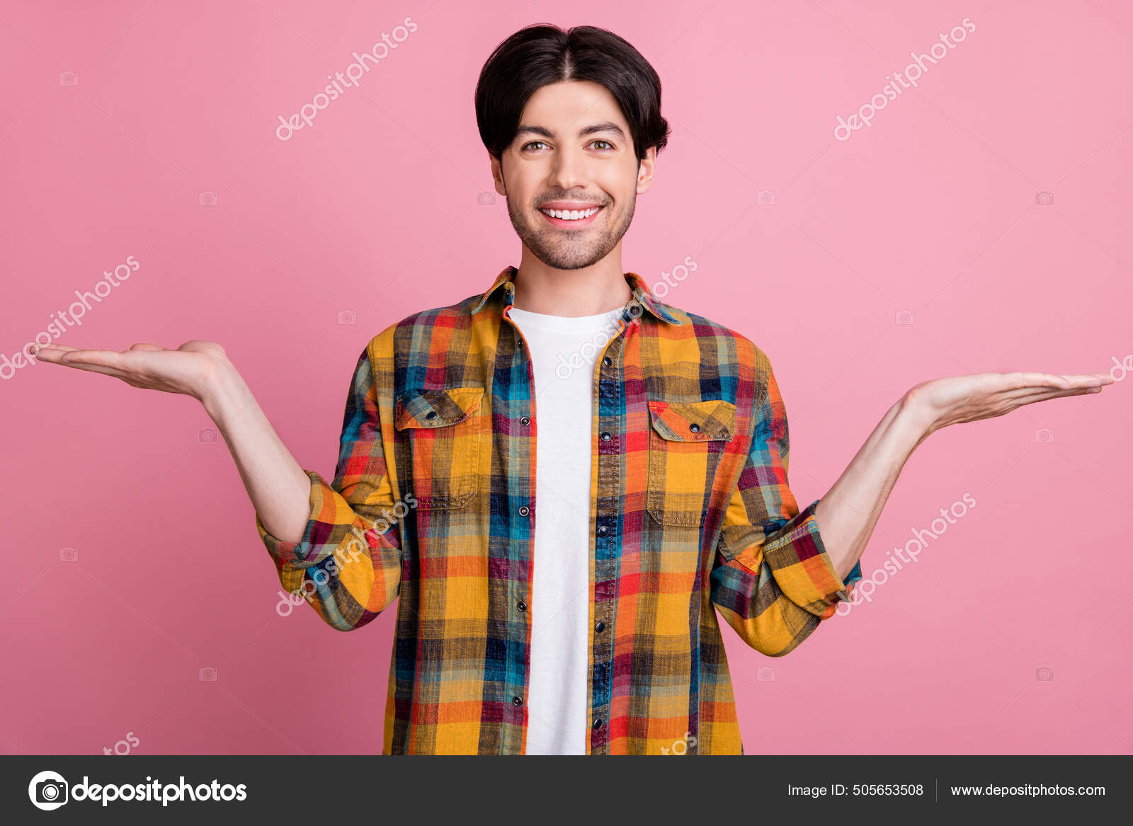 Photo of excited charming young guy dressed checkered clothes smiling ...