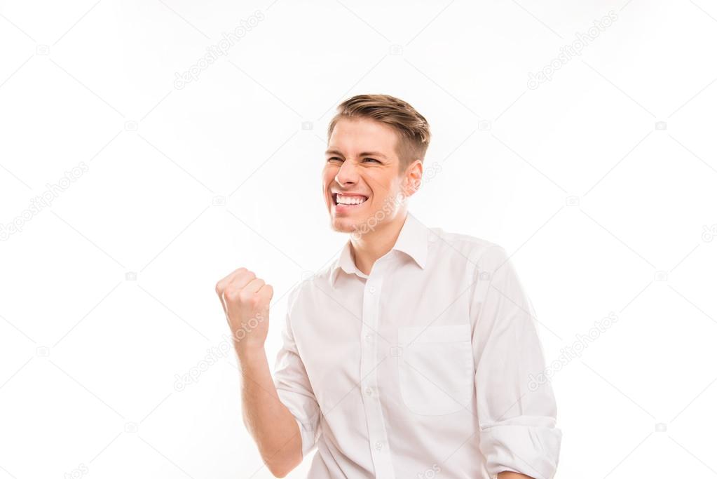 YES! Happy young man triumphing with raised hand — Stock Photo ...
