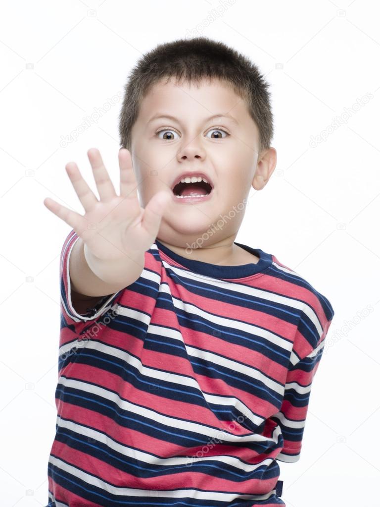Kid show stop hand gesture and screaming Stock Photo by ©diogoppr 69762639