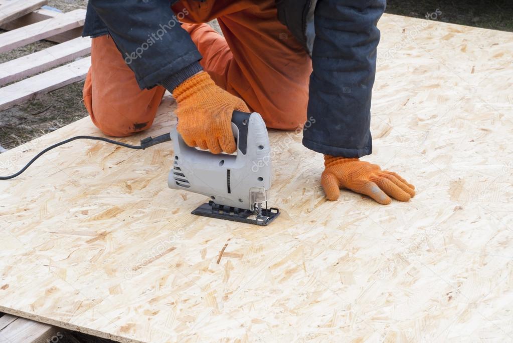 Sawing OSB plywood Stock Photo by ©mkuchina 90173740