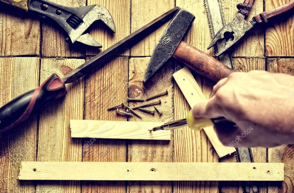 Hands holding tool. — Stock Photo © MagMac83 #76676805