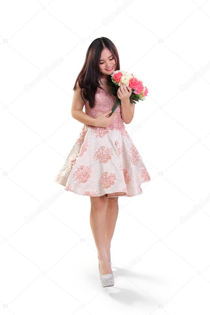 Girl walking with bunch of roses full length isolated — Stock Photo ...
