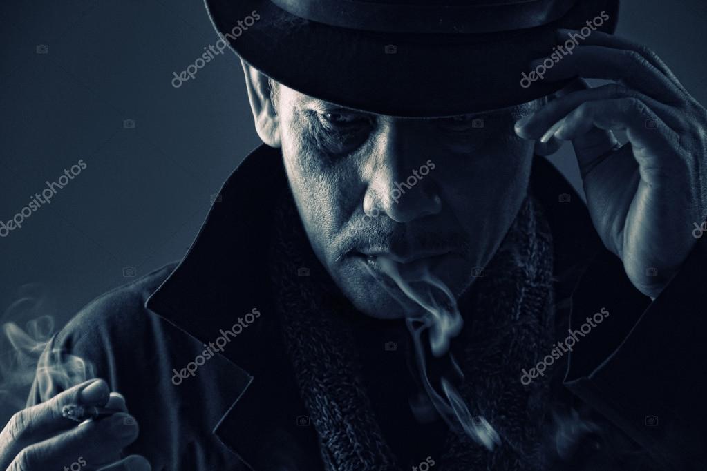 Cold blooded assassin adjusting his hat Stock Photo by ©PepscoStudio ...