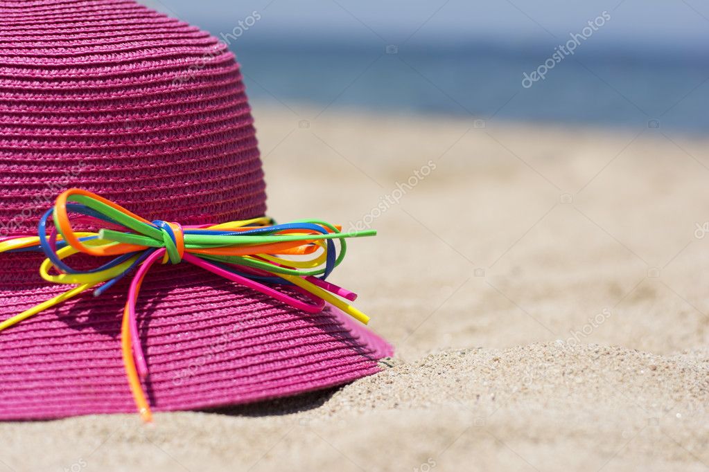 Summer hat on a beach Stock Photo by ©NewNow 79071680