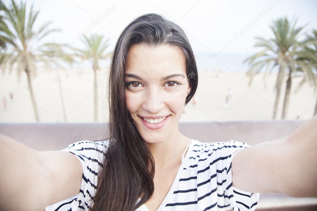 Selfie woman taking self portrait at beach. Stock Photo by ©Jandruk ...