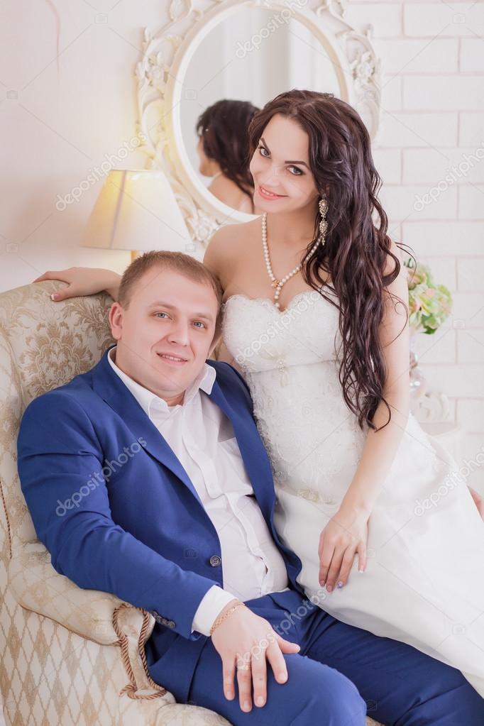 Bride and groom looking fondly of each other indoor — Stock Photo ...