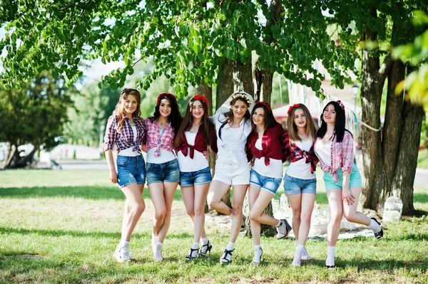 Seven Happy And Sexy Girls On Short Shorts And White Shirts Runn Stock