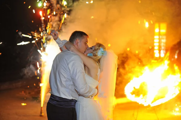 Wedding couple on fire show - Stock Image - Everypixel