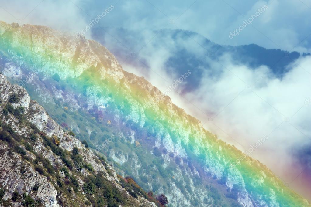 Clear rainbow on mountain ridge — Stock Photo © toucanet #86640782