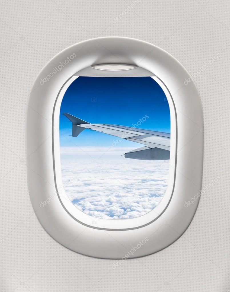 Looking out the window of a plane to the aircraft wing and cloud Stock ...