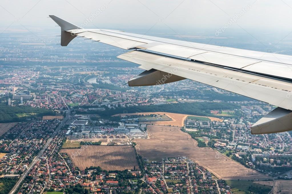 Looking through window airplane Stock Photo by ©andriano_cz 83575474