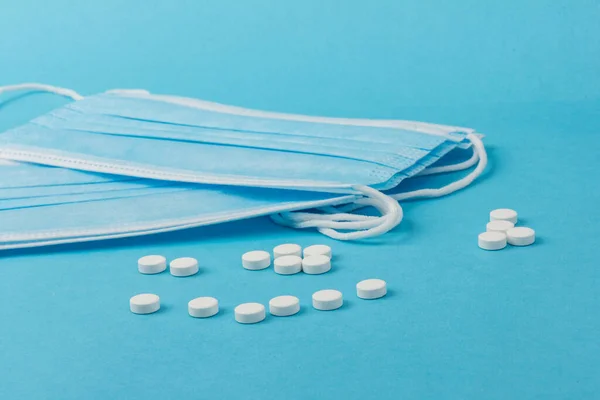 Prevent coronavirus. Medical protective mask whith white pills ...