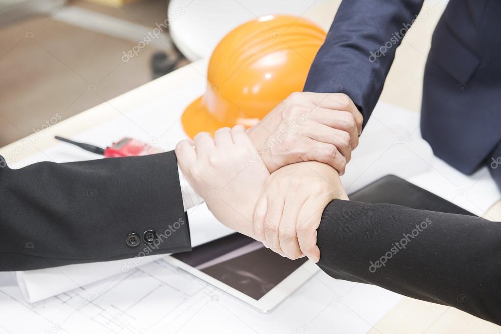 3 Hand Assemble Teamwork for success of the business in the futu Stock ...