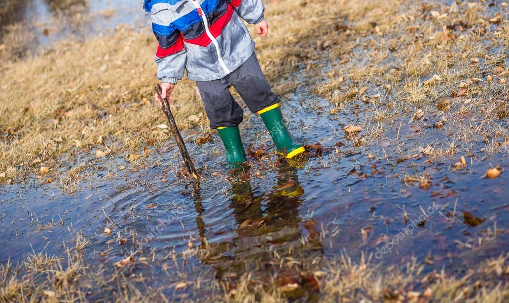 A little boy playing with a stick — Stock Photo © juliannafunk #70957367